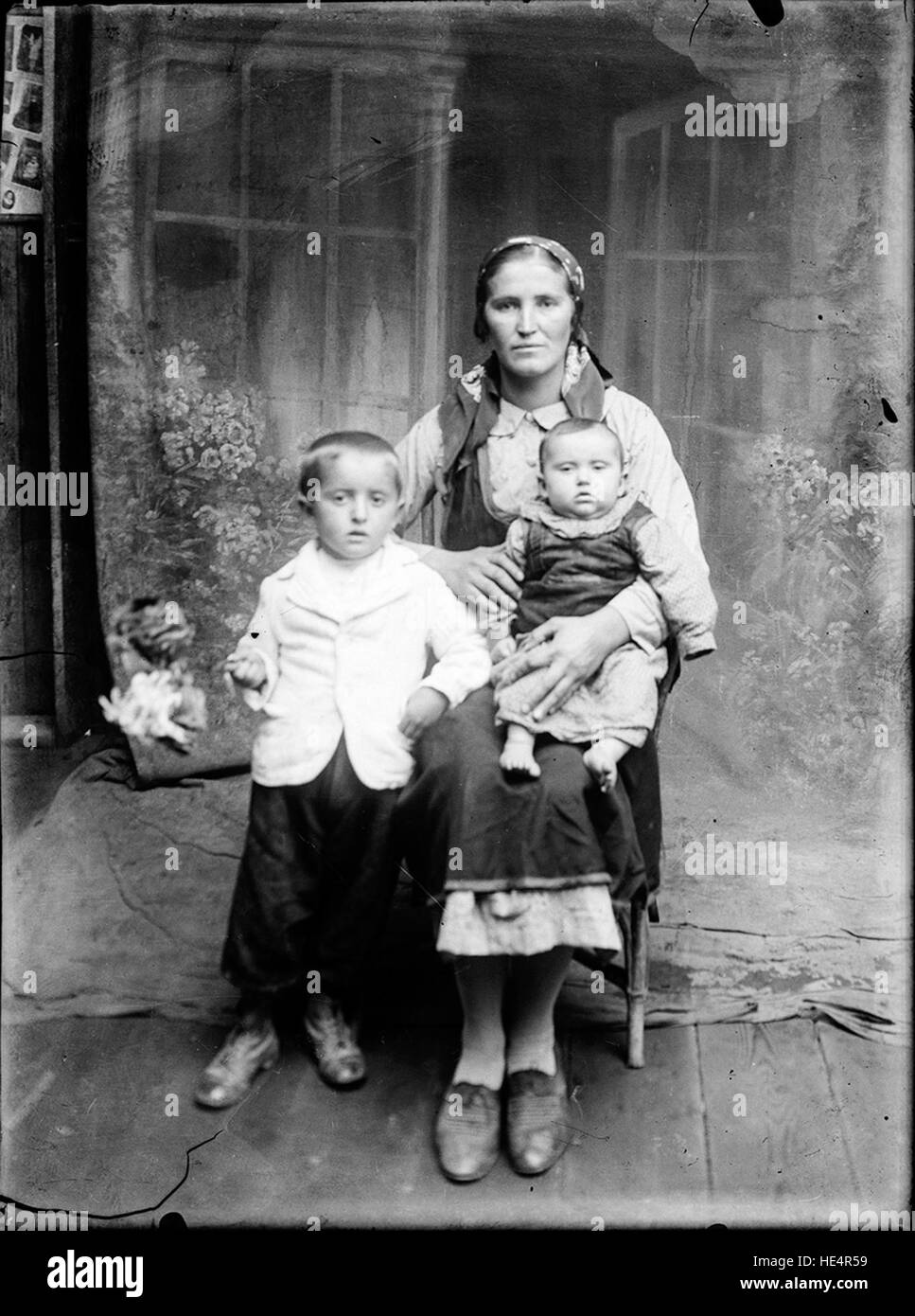 Historic Romanian mother with two children, rural life, early 1900s ...