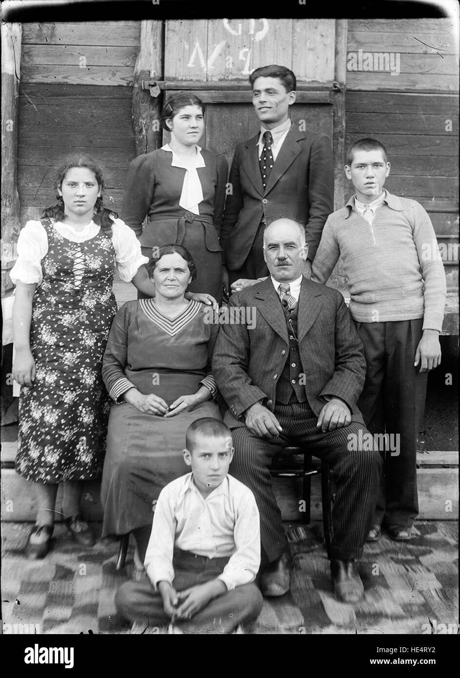 A historical family portrait captured by Costică Acsinte, showcasing a ...