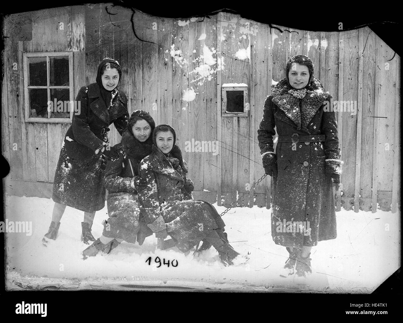 Four young women on a sleigh, Romania, 1940, captured on a glass plate ...