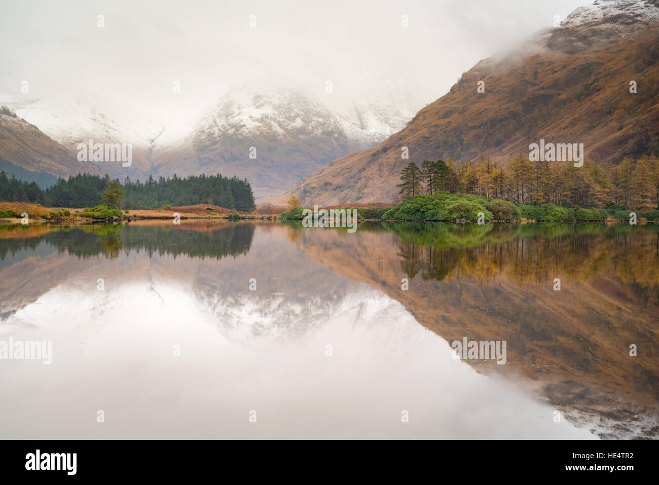 Glencoe mountains reflected in Lochan Urr, Glen Etive, Scotland Stock ...