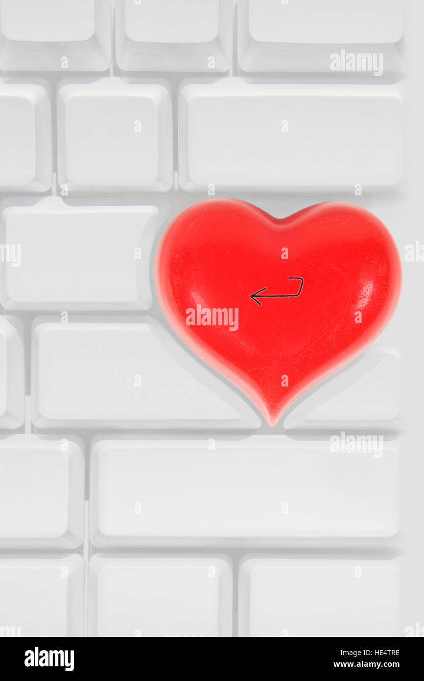 White computer keyboard with a red love heart shaped return key Stock ...