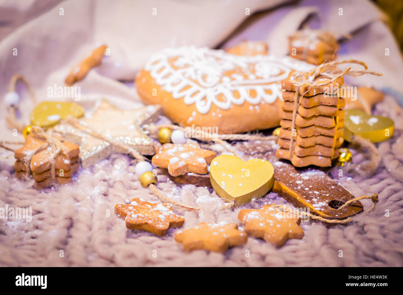 Gingerbread heart-shaped, sugar stars cookies on knitted backgro Stock ...