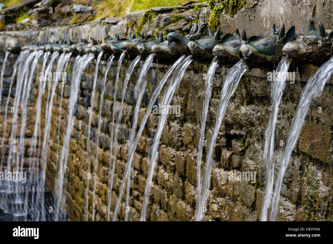 The sacred water flows out of 108 pipes around the temple complex Stock ...