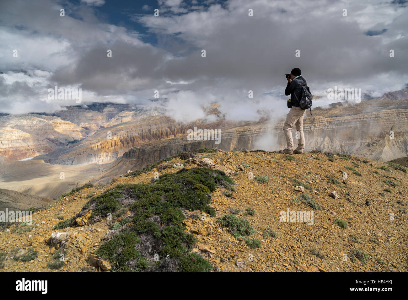 A photographer is taking a picture of the barren landscape of Upper ...