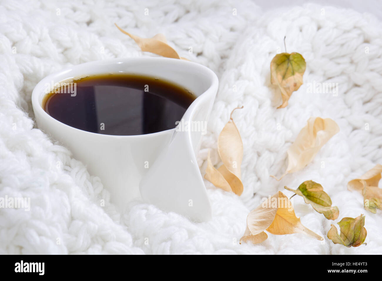 cozy cup of coffee covered with wool Stock Photo - Alamy
