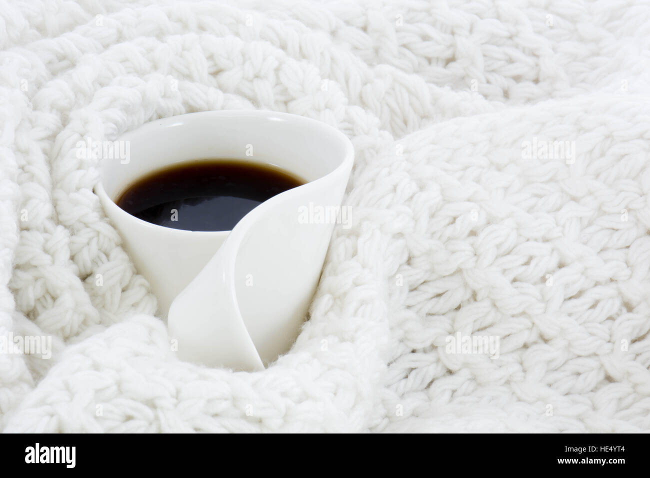cozy cup of coffee covered with wool Stock Photo - Alamy
