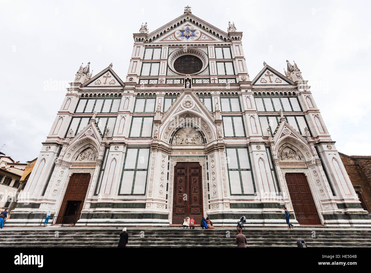 FLORENCE, ITALY - NOVEMBER 6, 2016: tourists on steps of Basilica di ...