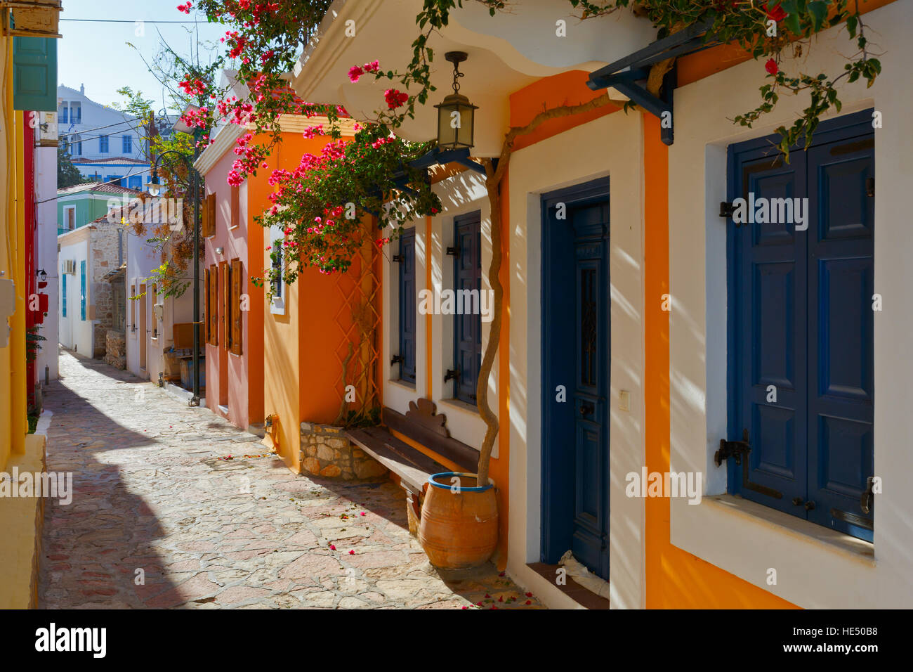 Colorful architecture in a street of Halki village, Greece Stock Photo ...