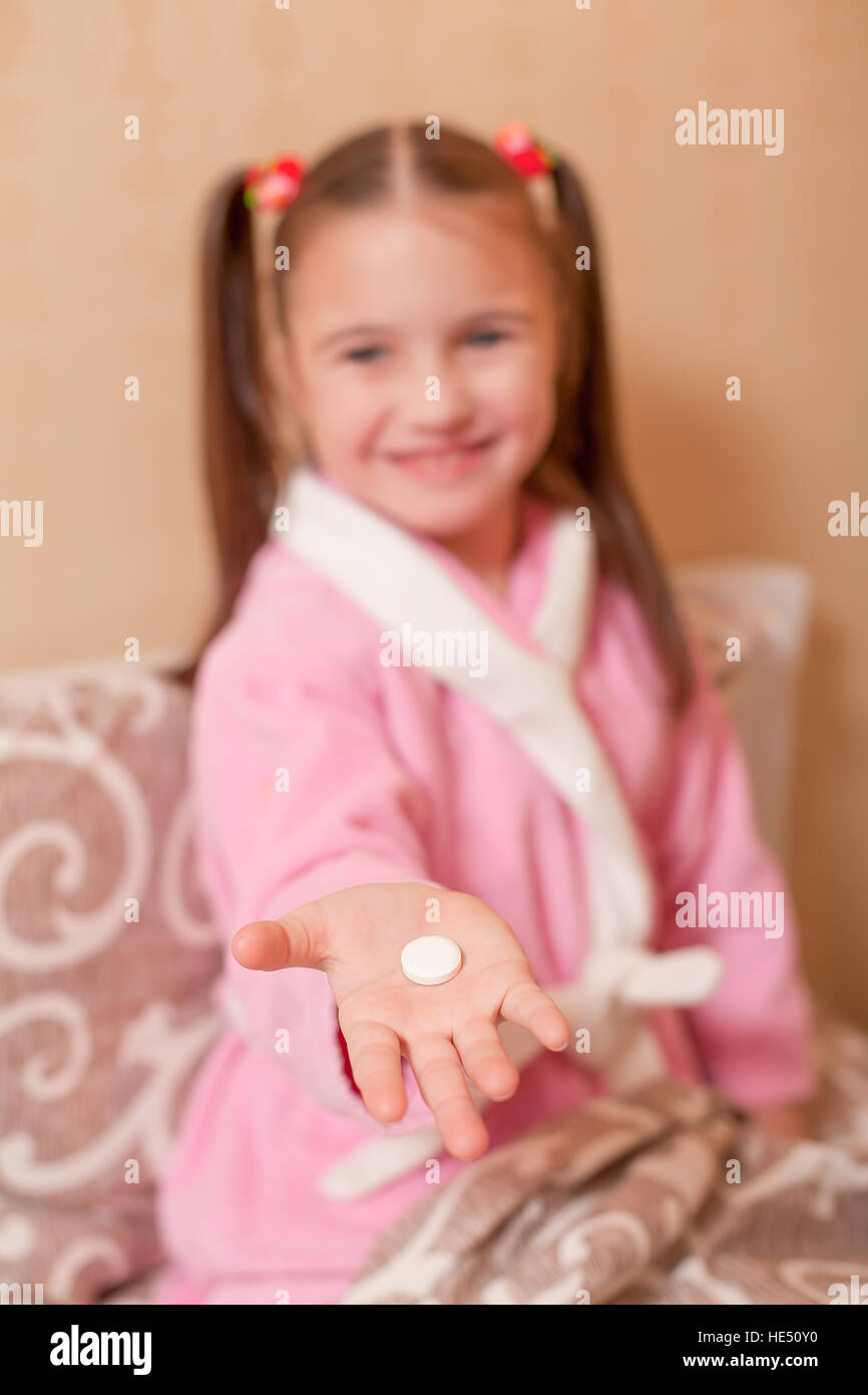 Focused little girl hand with tablet Stock Photo - Alamy