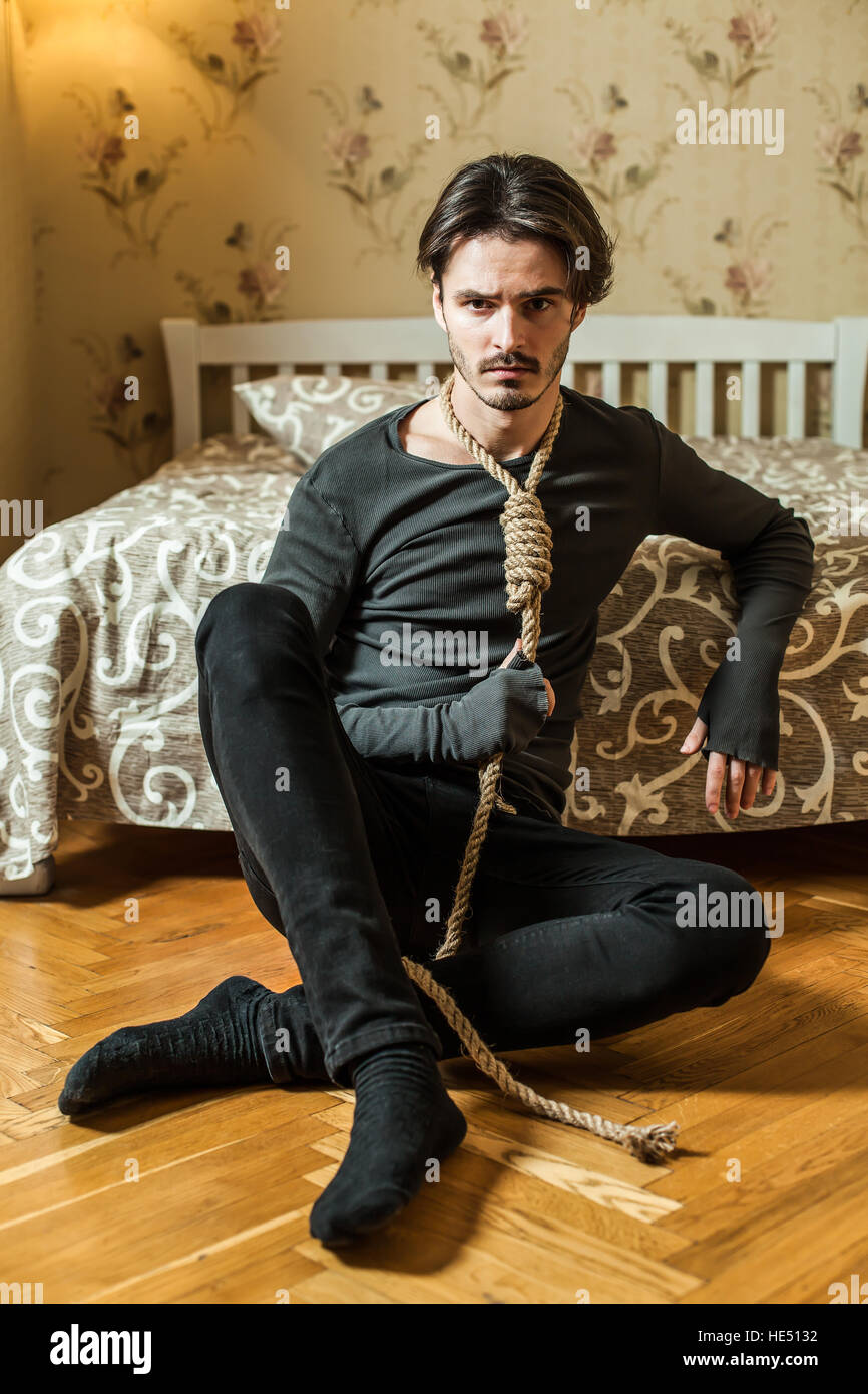 Stressed man with loop around his neck Stock Photo - Alamy