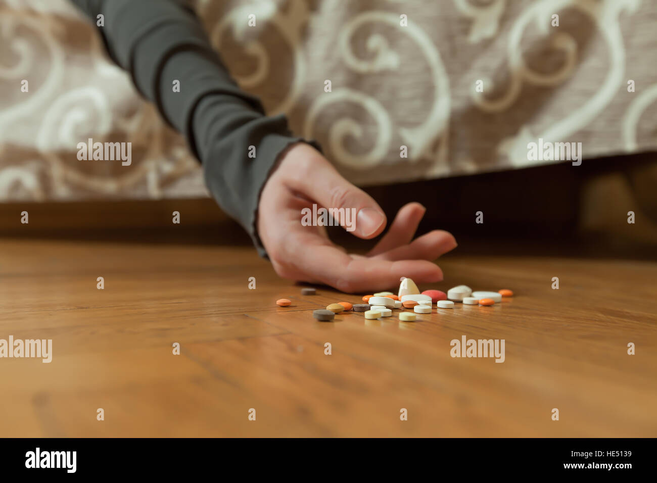 Depressed man commit suicide with drugs overdosing Stock Photo - Alamy