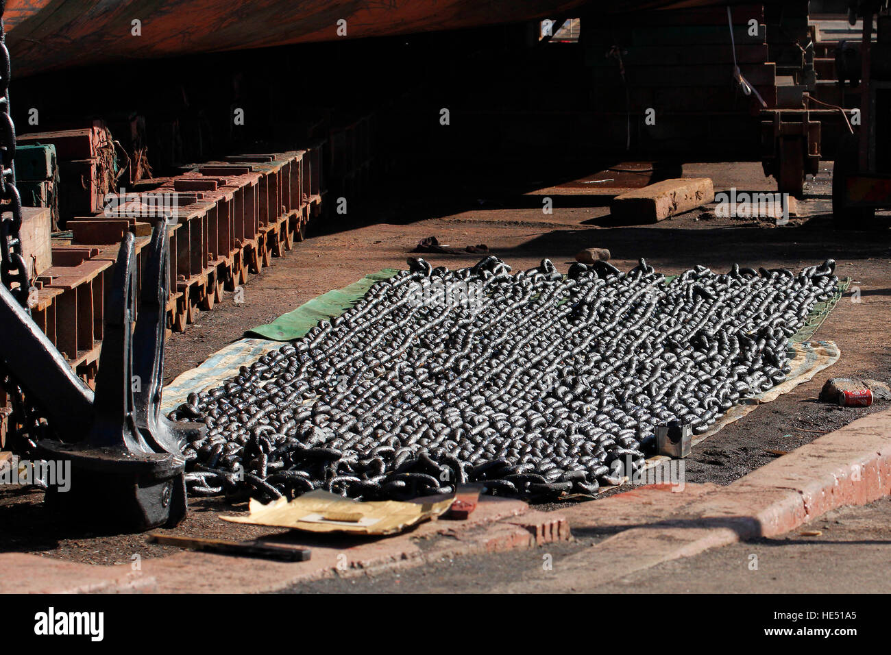 A new anchor and chain ready to be fitted to a Taiwanese fishing boat ...