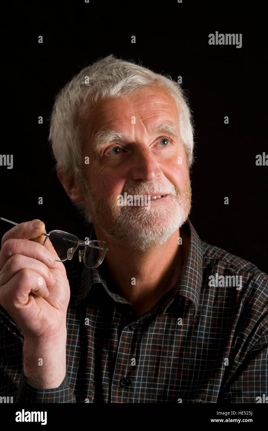 Senior citizen, man, 60 +, portrait, holding his glasses in his hand ...