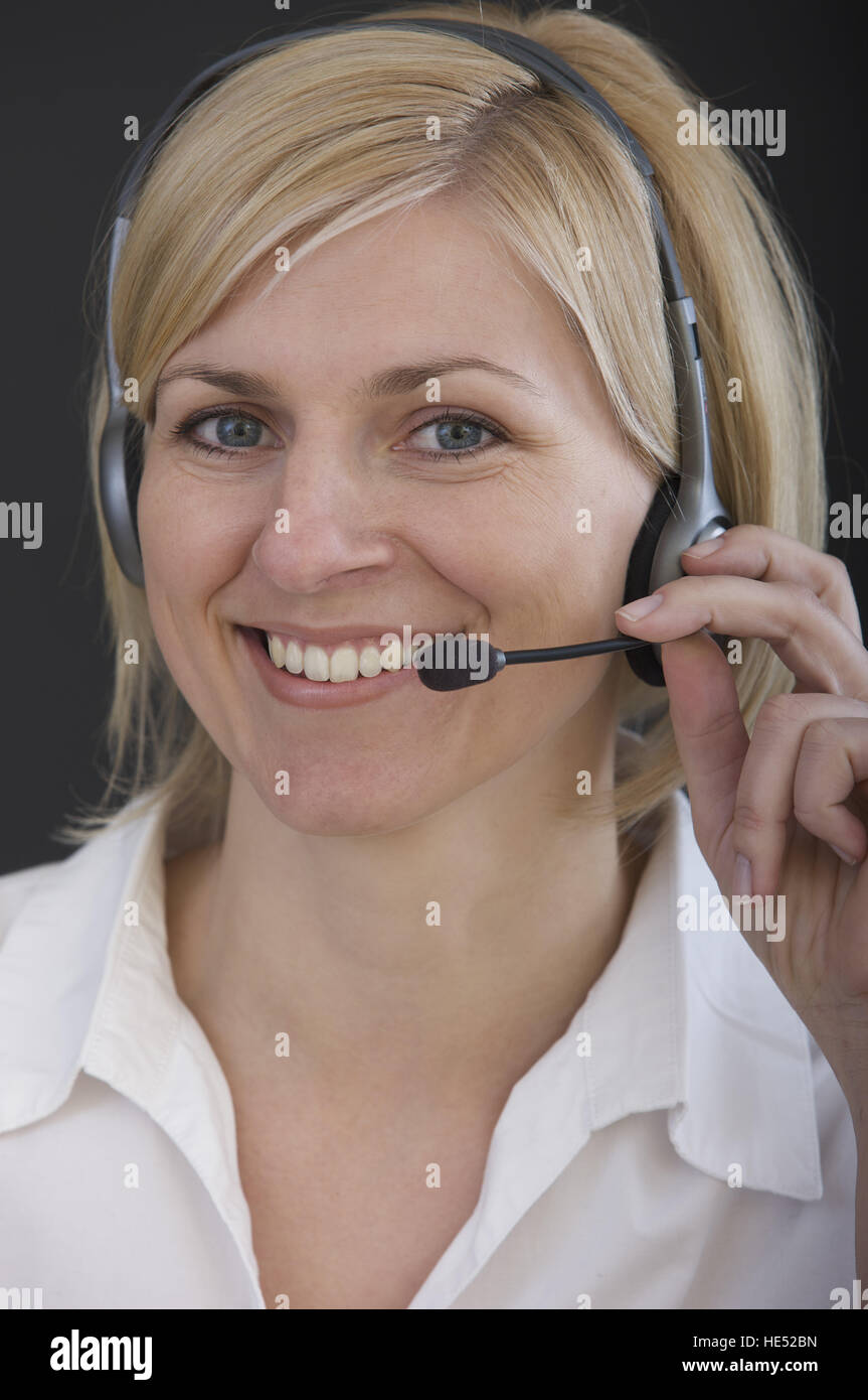 Woman wearing a headset Stock Photo - Alamy