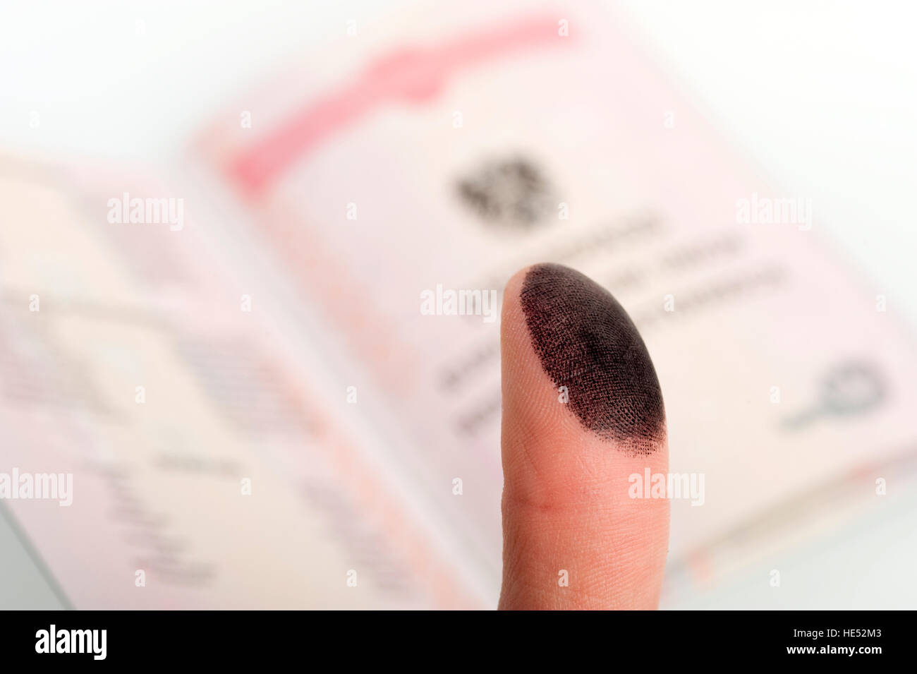 Fingerprint in a passport, symbolic picture Stock Photo - Alamy