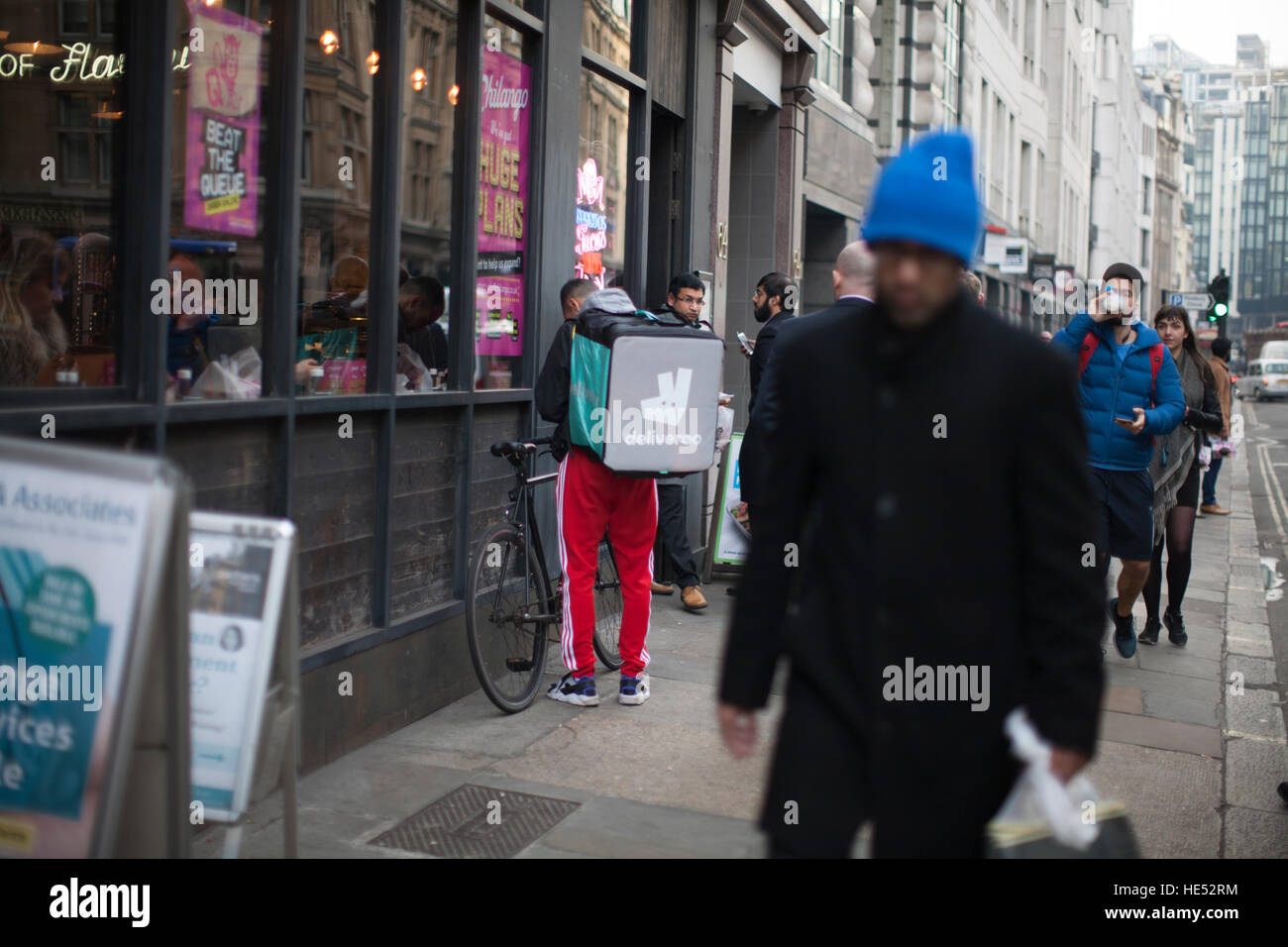 Deliveroo cyclist central London Stock Photo - Alamy