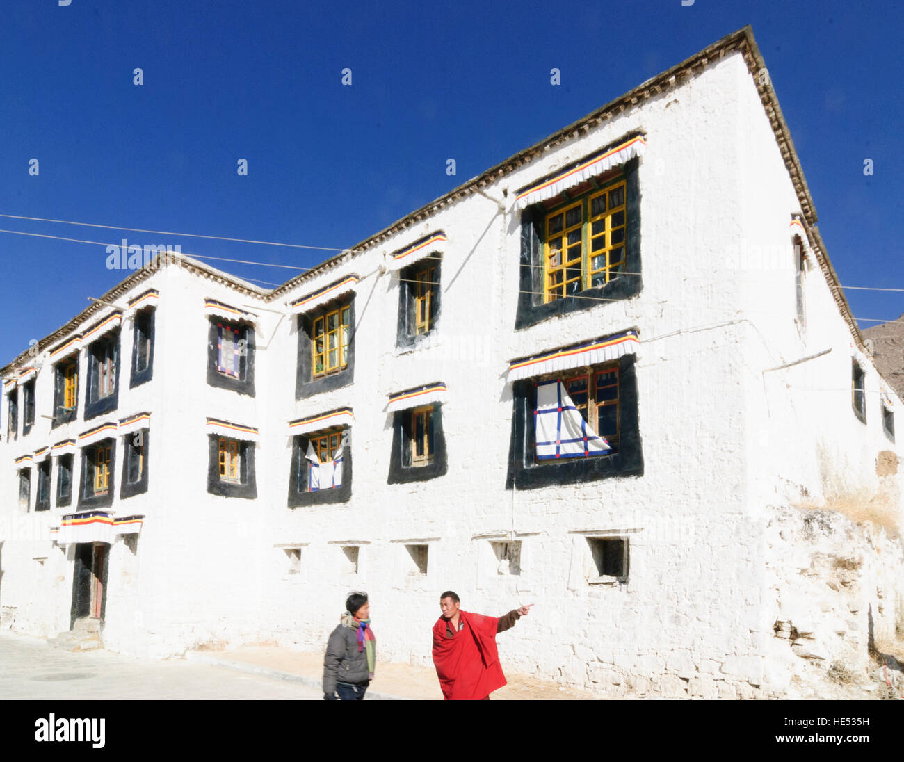 Monk in front of monks residential buildings hi-res stock photography ...