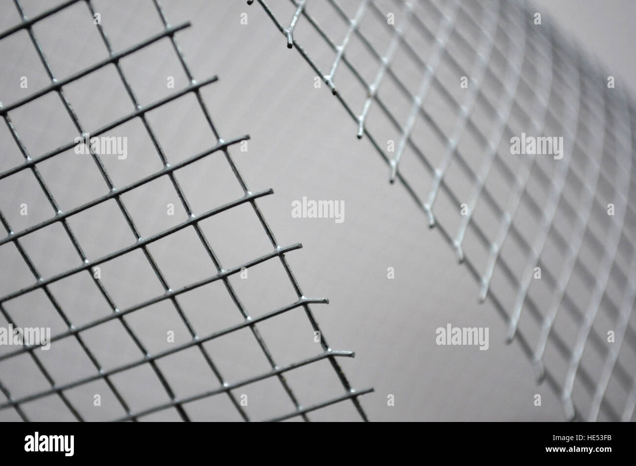 chain-link fence with abstract shapes Stock Photo - Alamy