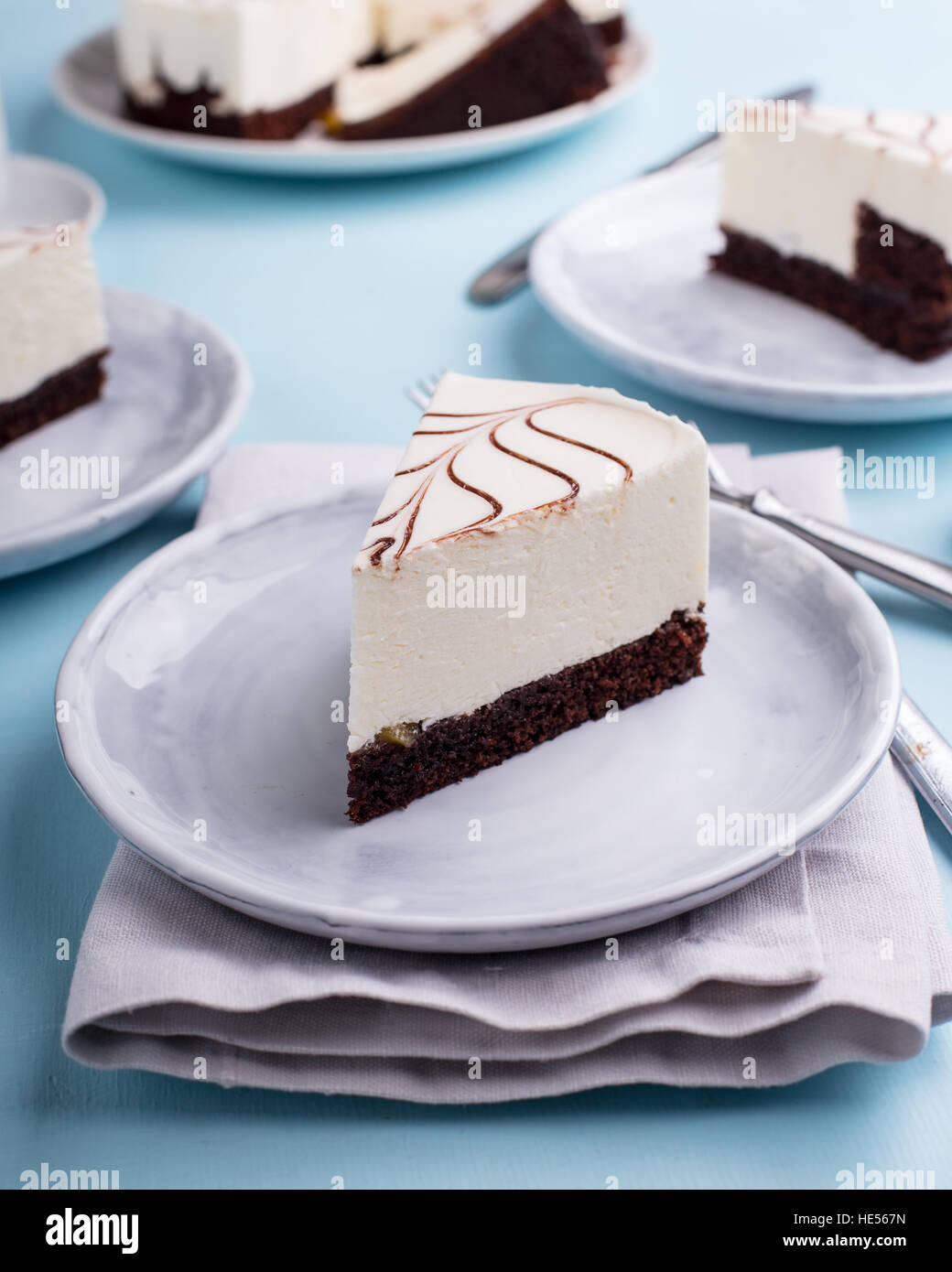 Portion of a delicious cheesecake on a chocolate sponge Stock Photo - Alamy