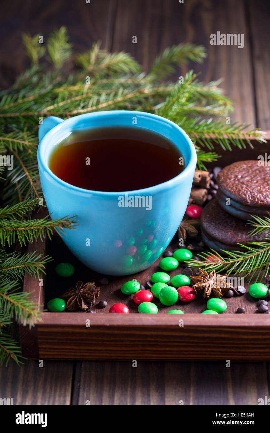 Large mug full of tea with some colorful chocolate candies Stock Photo ...
