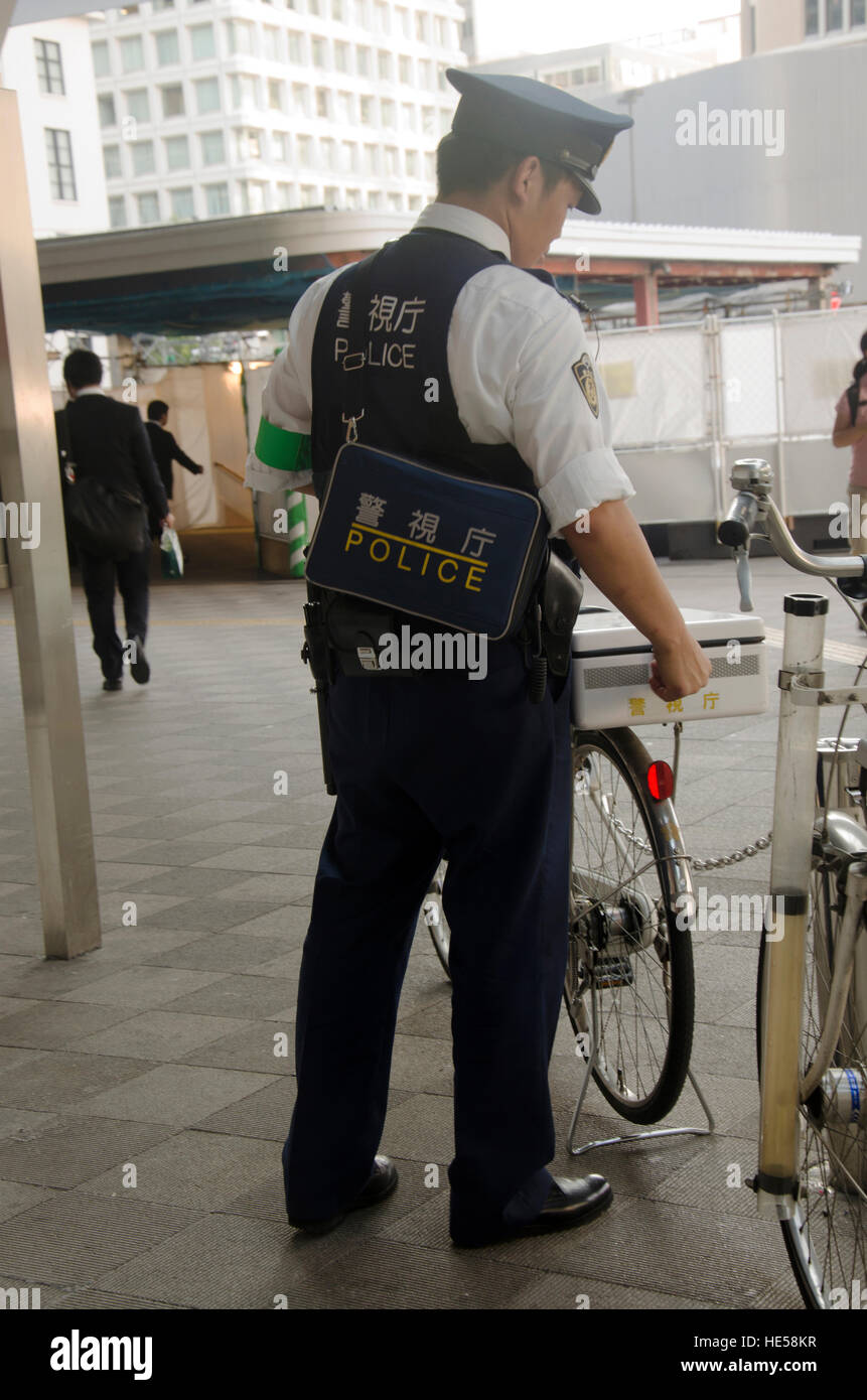 Japanese policemen people stopping bicycle after bike bicycles check ...