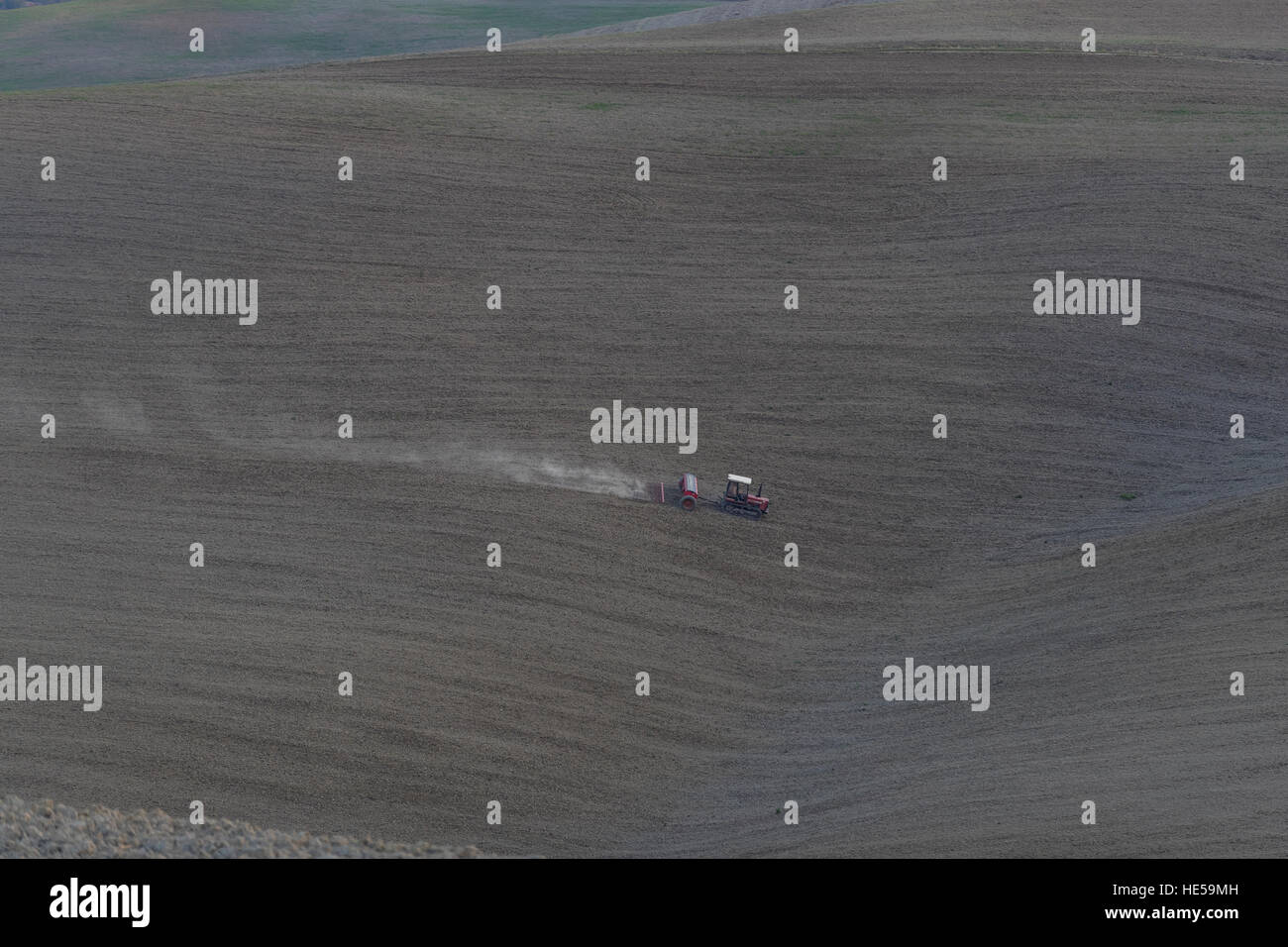 The thin soils of Tuscany ploughed at steep angles. Tuscan hills near ...