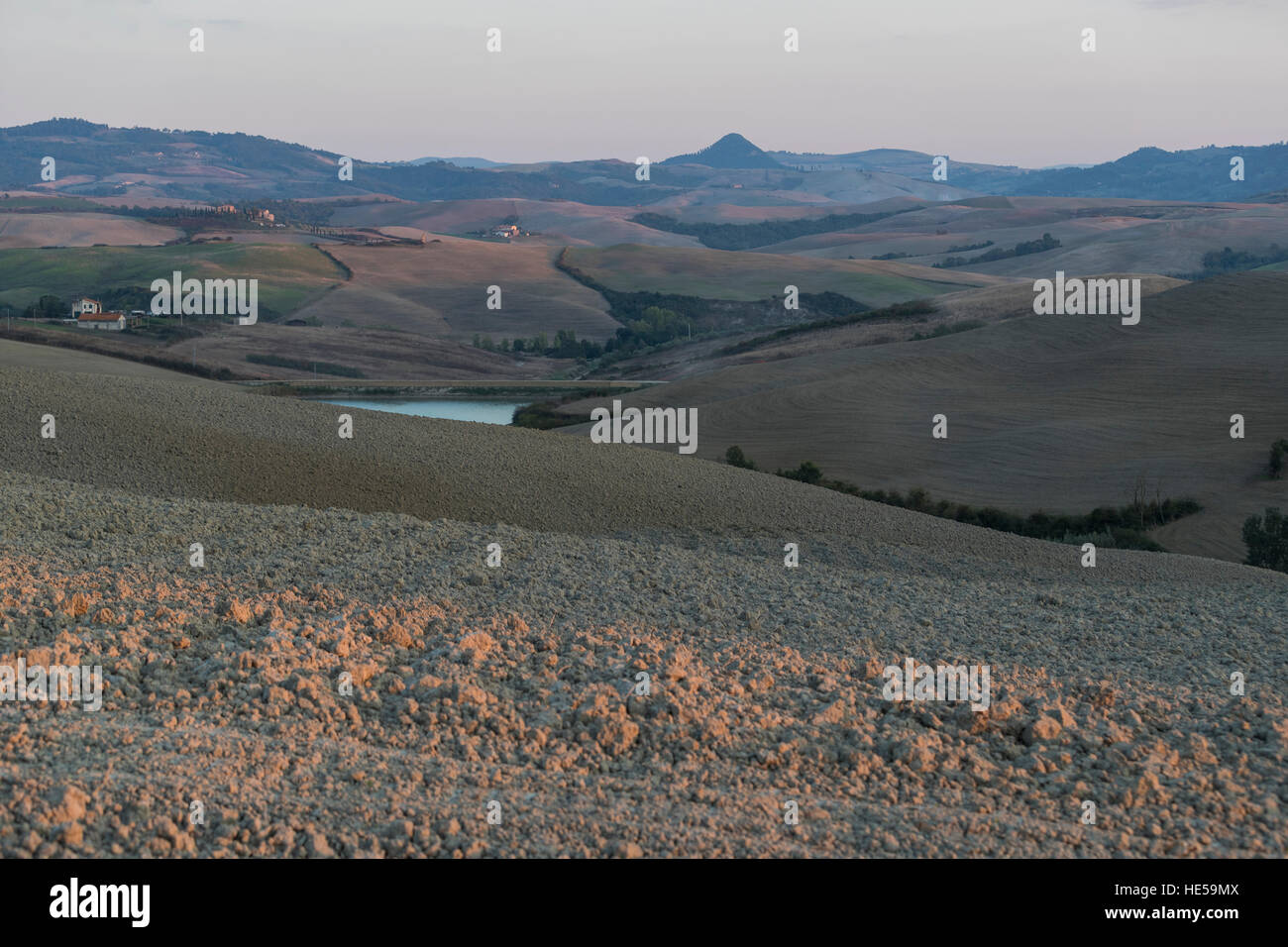 The thin soils of Tuscany ploughed at steep angles. Tuscan hills near ...