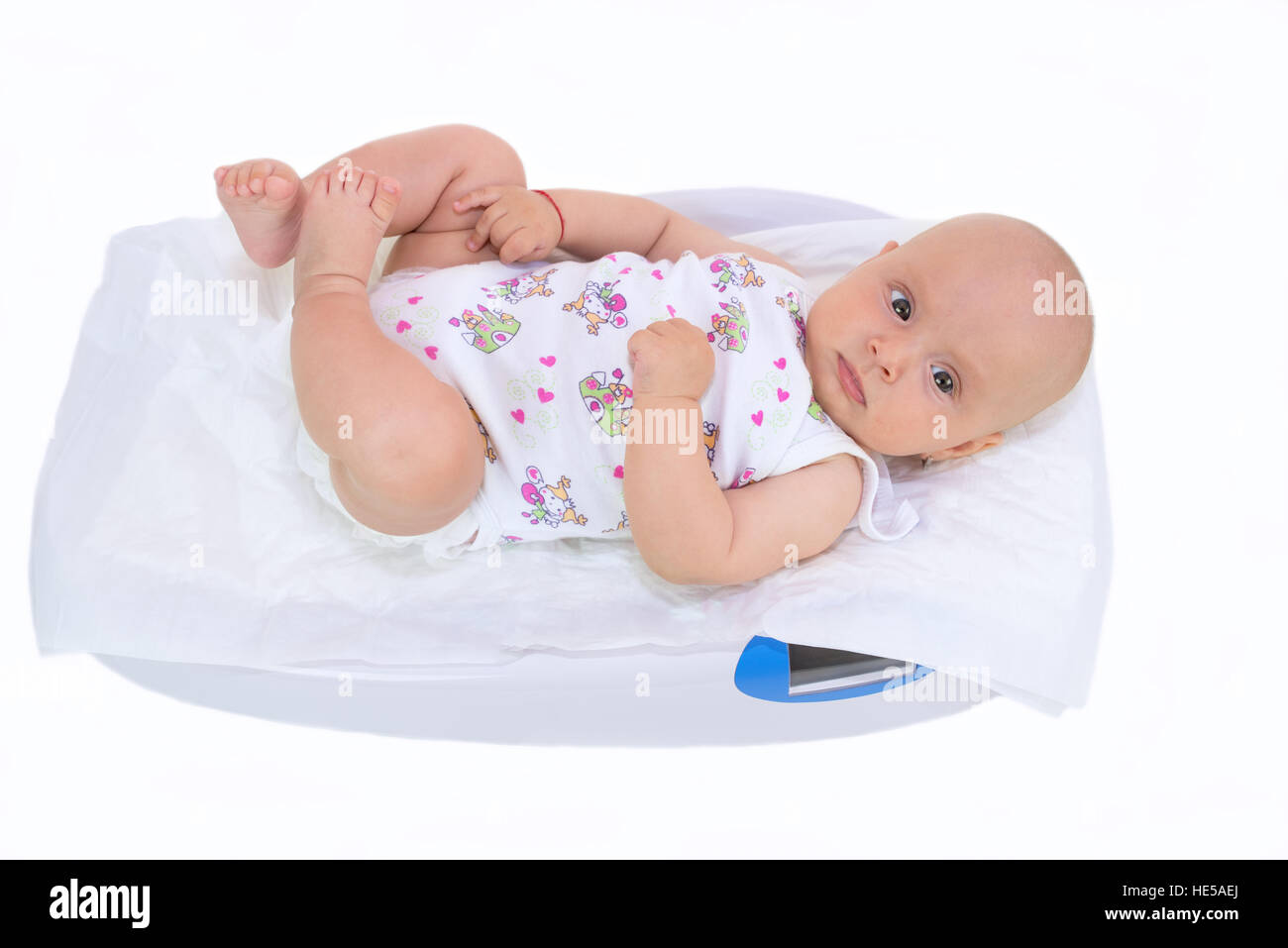 Baby on scale isolated Stock Photo - Alamy