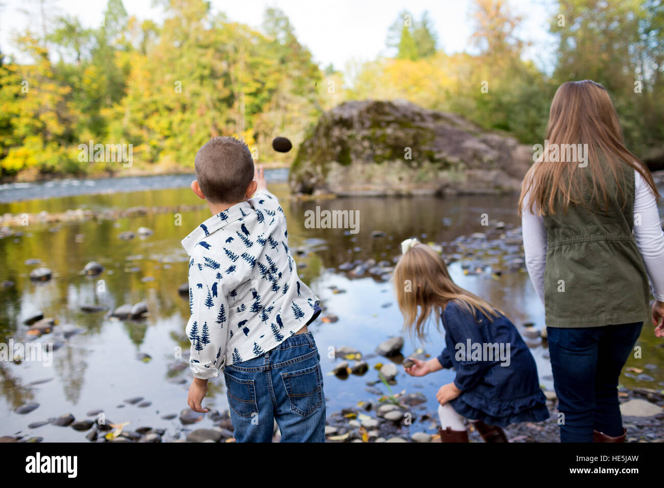 Children girl throwing rocks hi-res stock photography and images - Alamy