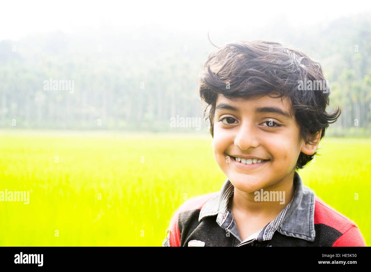 A pitcher of a kid in the villages of India in the horizon Stock Photo ...