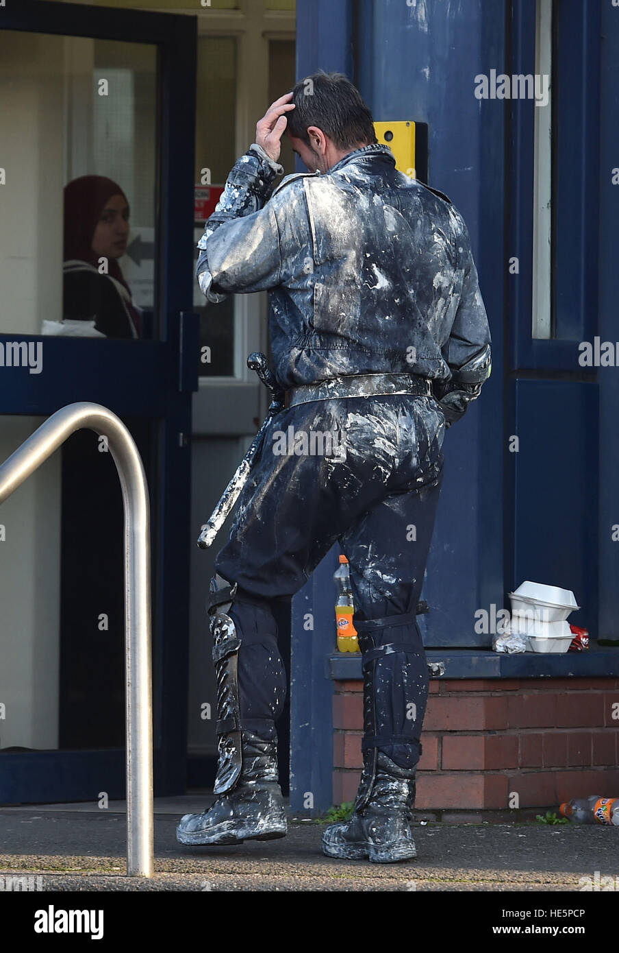 A member of the "Tornado Team" at HMP Birmingham covered in paint after ...