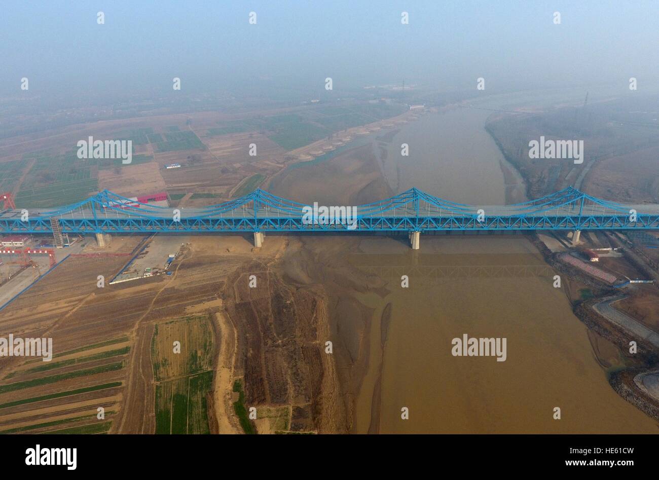 Jinan, China. 18th Dec, 2016. A road-rail bridge under construction is ...