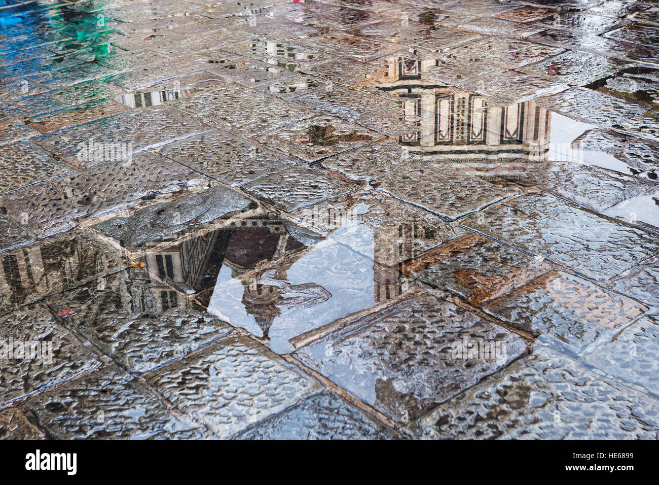 travel to Italy - rain puddle on pavement on piazza san giovanni near ...