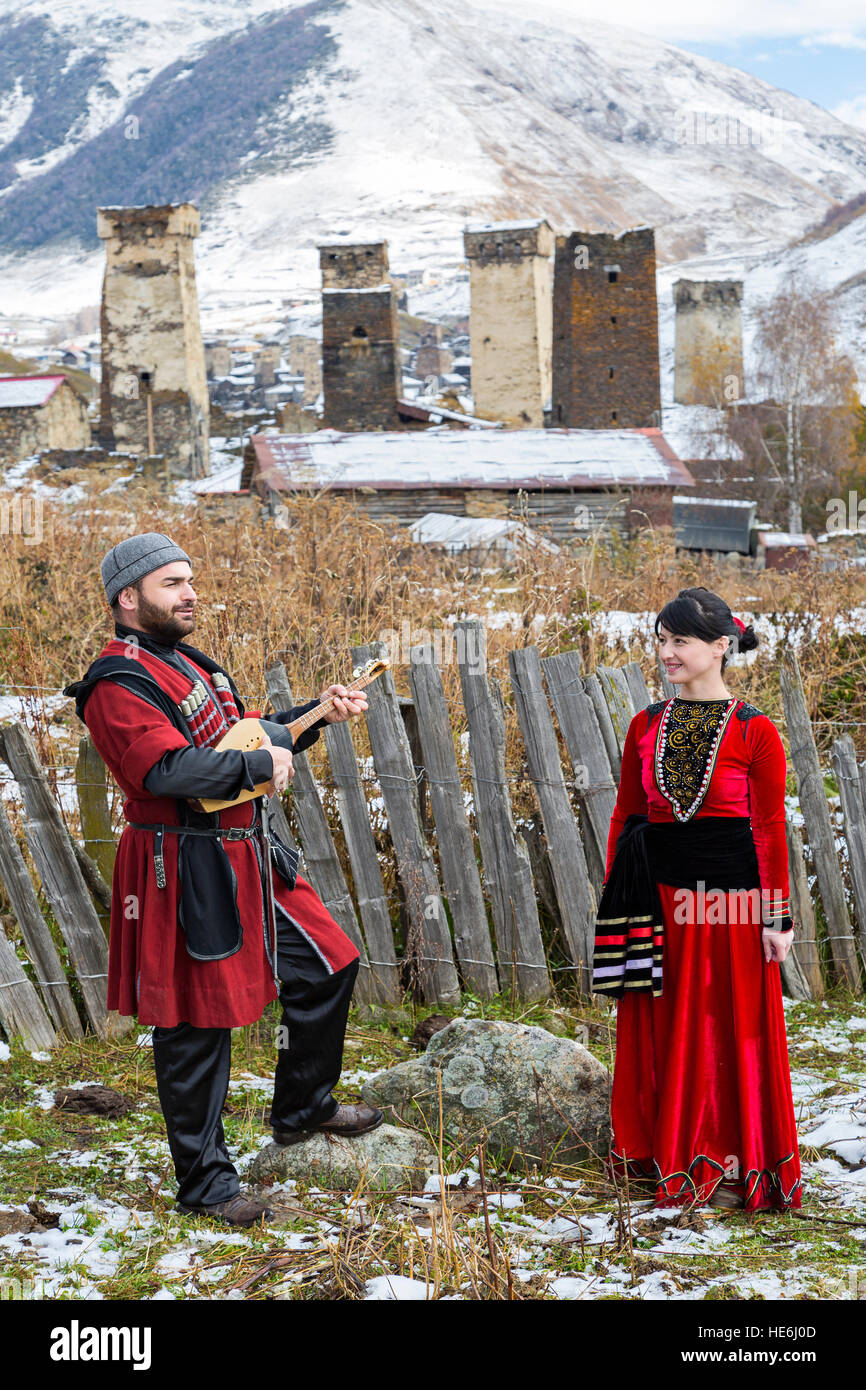 Georgian man in national costumes playing local musical instrument of ...