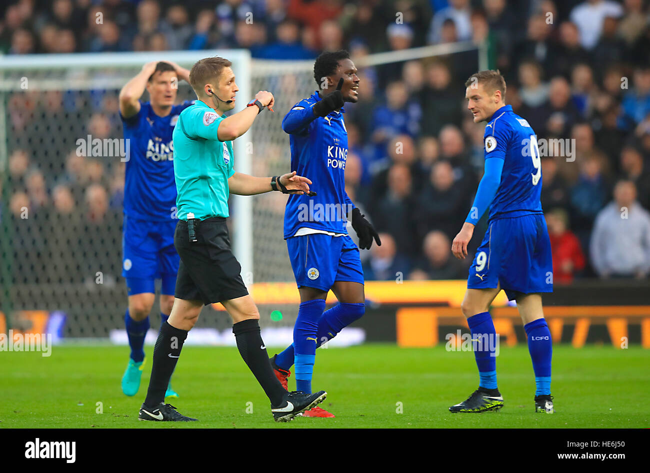 Leicester City's Jamie Vardy (right) is shown the yellow card by referee Craig Pawson during the ...
