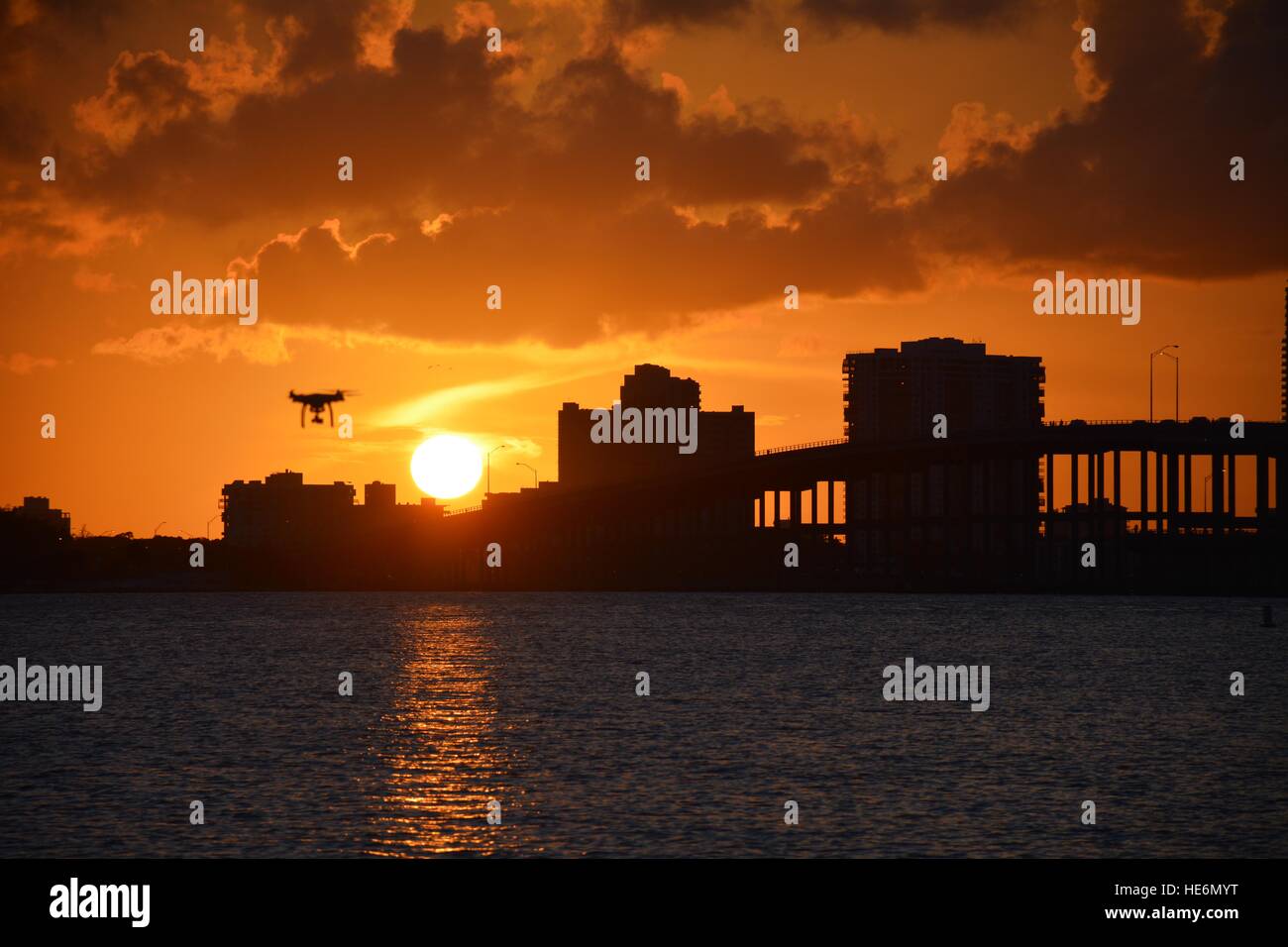 Miami sunset over rickenbacker bridge with drone flying on the way ...