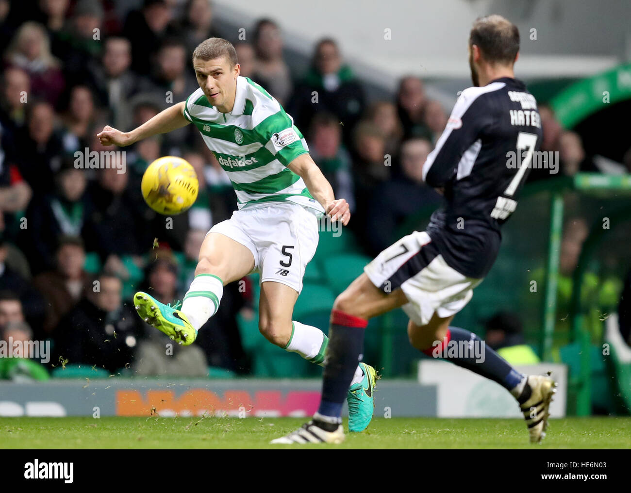 Celtic's Jozo Simunovic (left) and Dundee's Tom Hateley battle for the ...