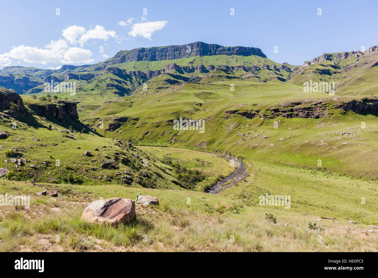 Mountains vehicle pass up steep valley river scenic landscape terrain ...