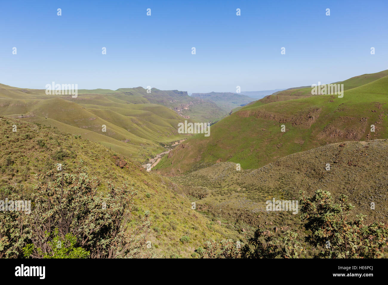 Mountains vehicle pass up steep valley river scenic landscape terrain ...
