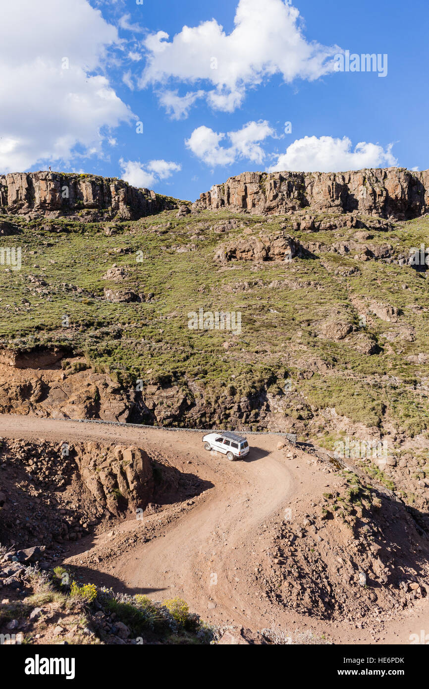 Mountains dirt road vehicle pass up steep route terrain overlooking ...