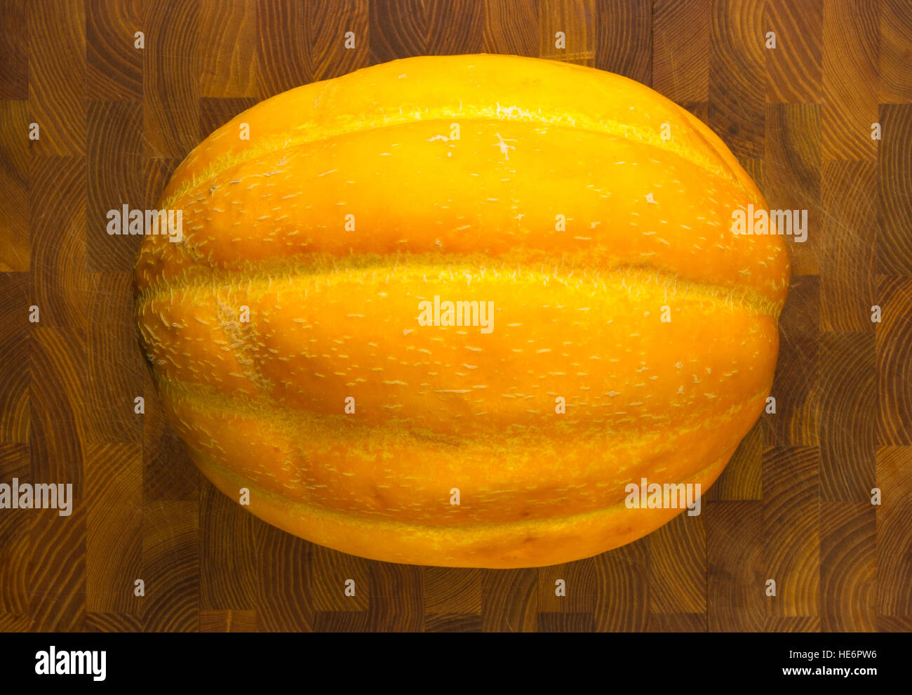 still life - ripe juicy Ethiopian melon on wooden background Stock ...