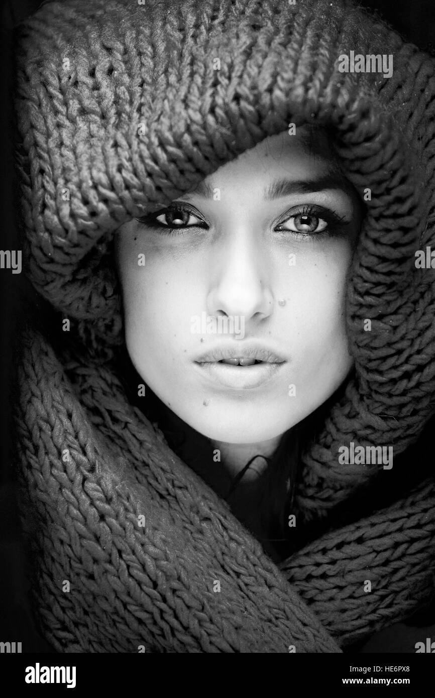 young pretty woman in sweater and scarf all over her face black and ...