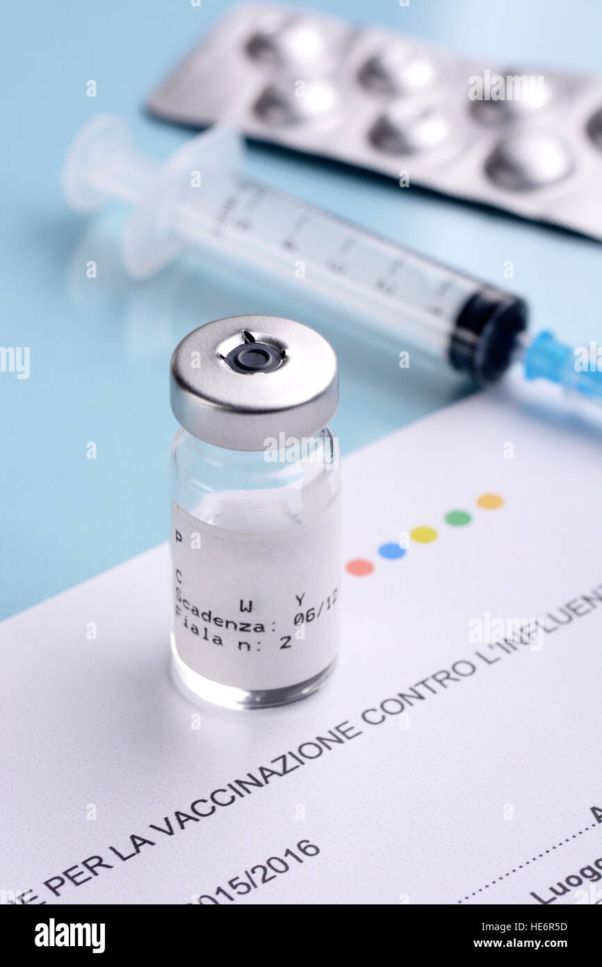 flu vaccine vial and syringe on the table Stock Photo - Alamy