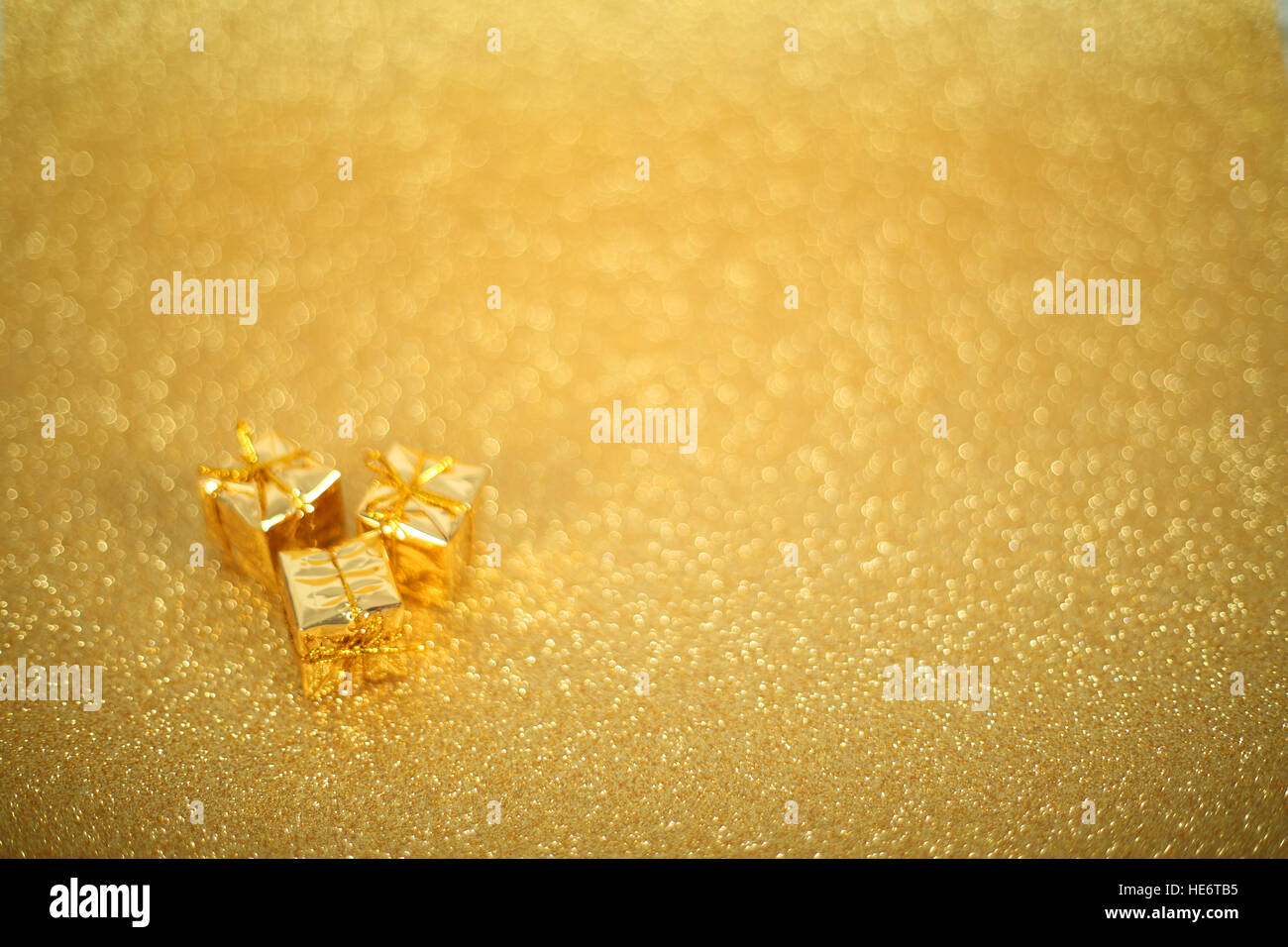 Holiday gift boxes on shiny golden background with copy space Stock ...