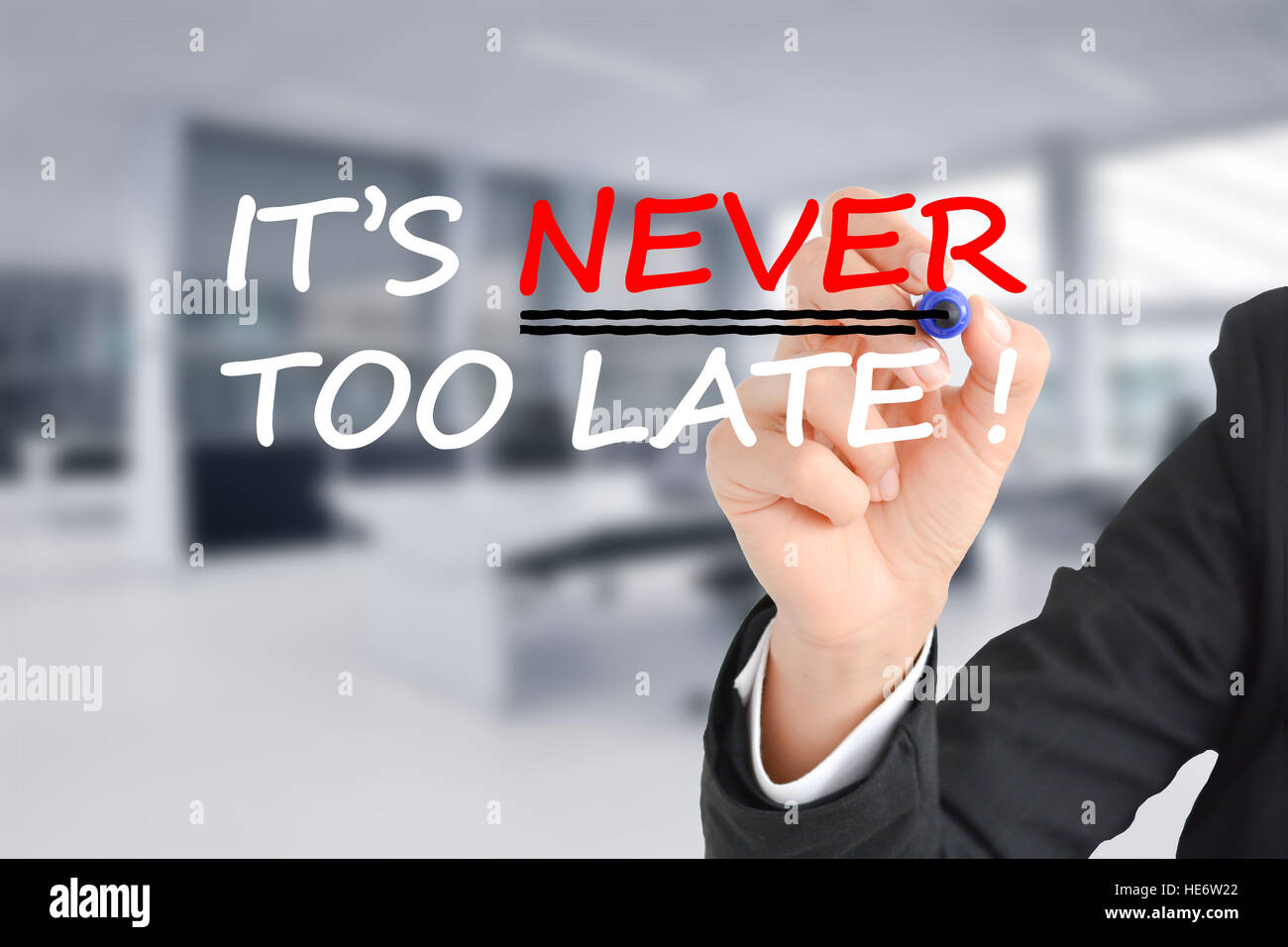 It is never too late text with businesswoman hand writing on ...