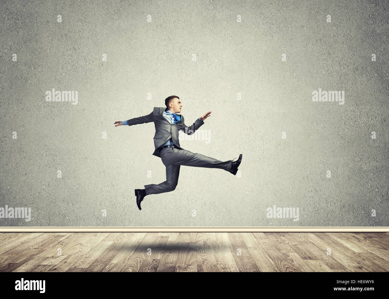 Businessman jumping high Stock Photo - Alamy