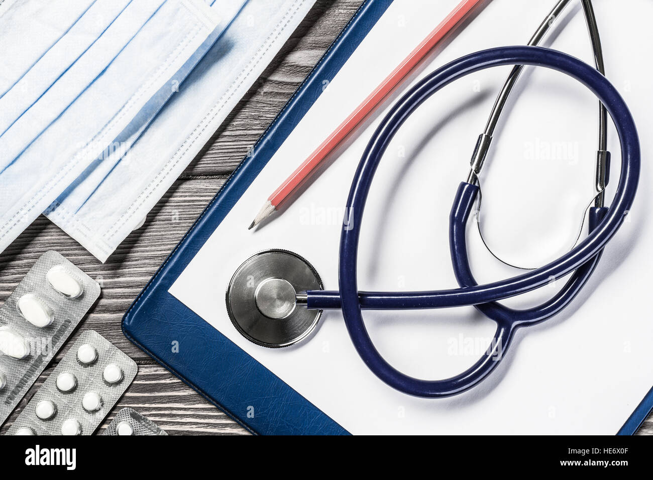 Desk of doctor with medicine things Stock Photo - Alamy