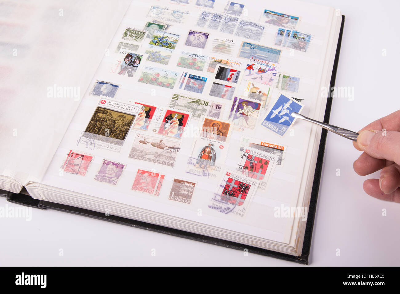 An album with a collection of postage stamps Stock Photo - Alamy