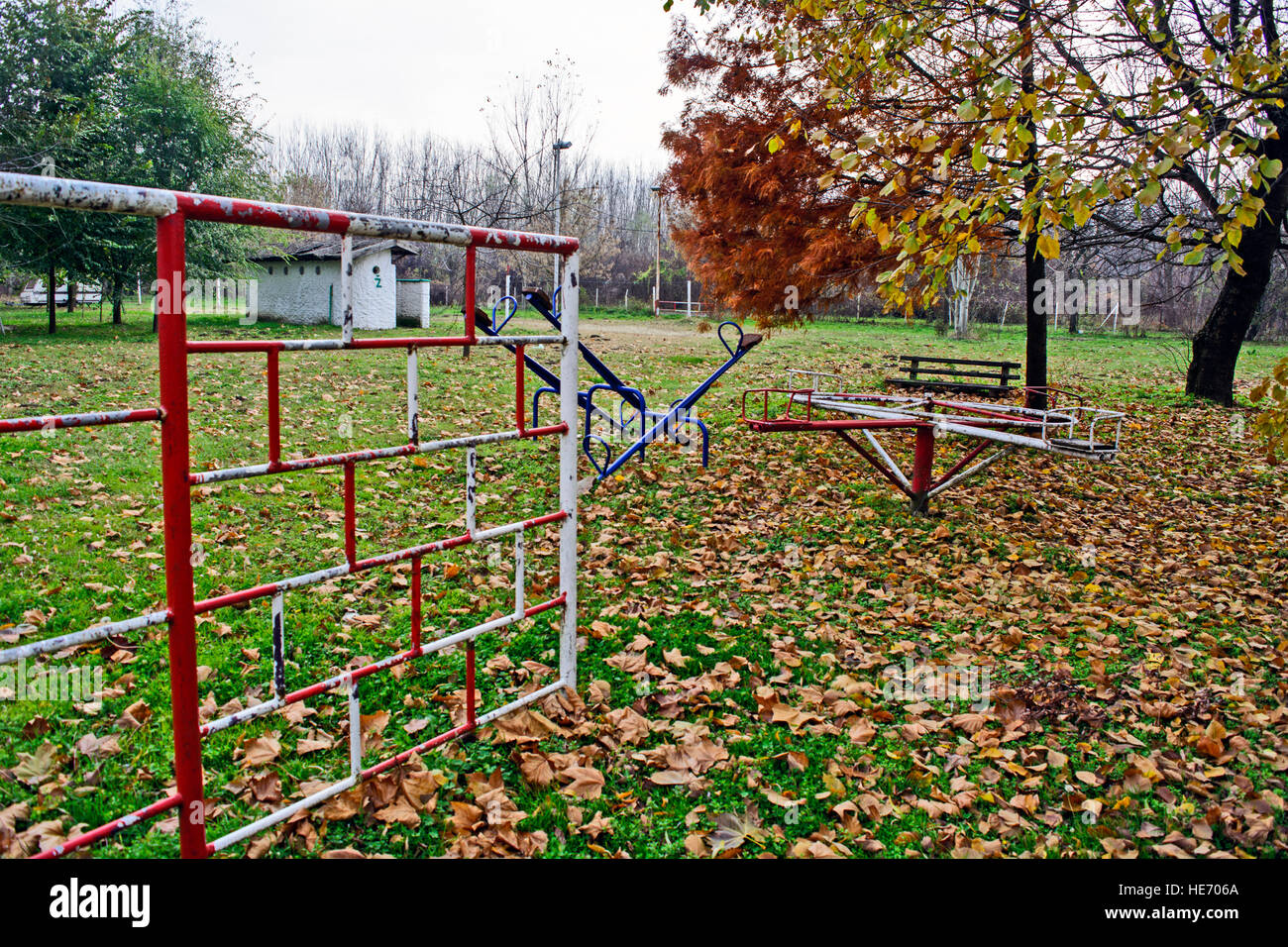 An empty playground on the bank of the river in autumn Stock Photo - Alamy