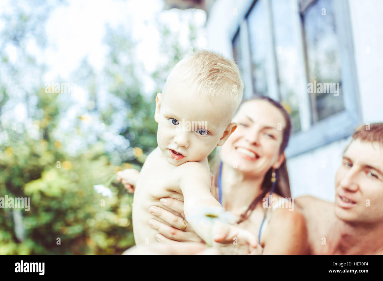 child focus parents on the background Stock Photo - Alamy